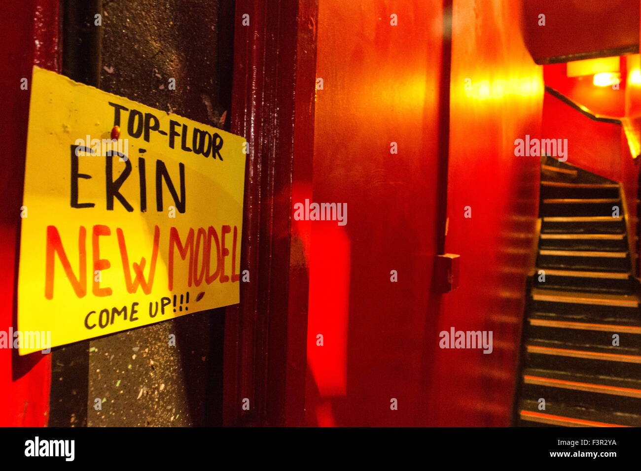 Advert for a 'new model' in the doorway in Soho's red-light district ...