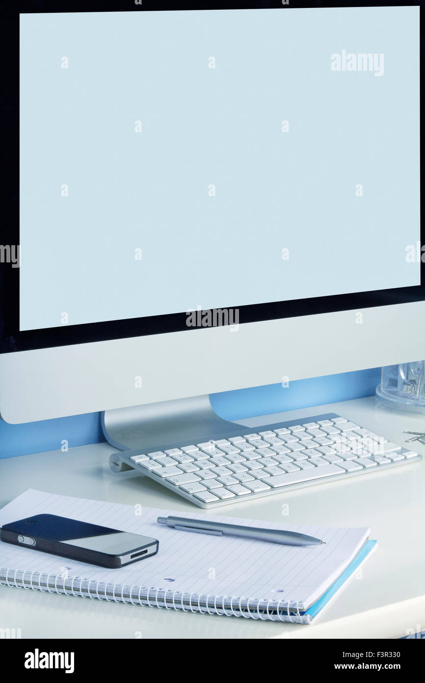 Home office interior set up with a mobile phone and desktop computer ...