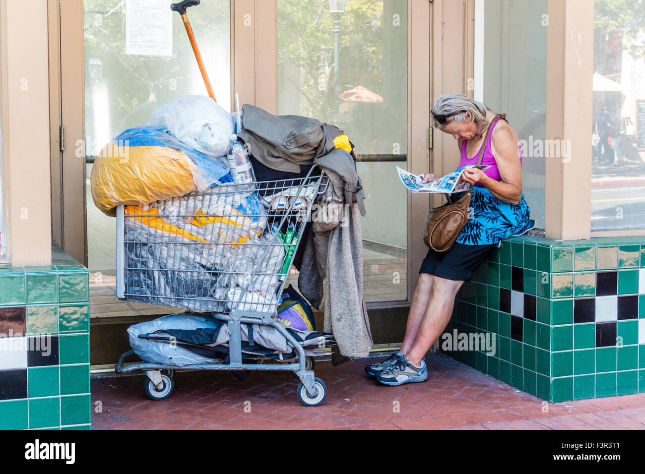 Homeless woman cart hi-res stock photography and images - Alamy