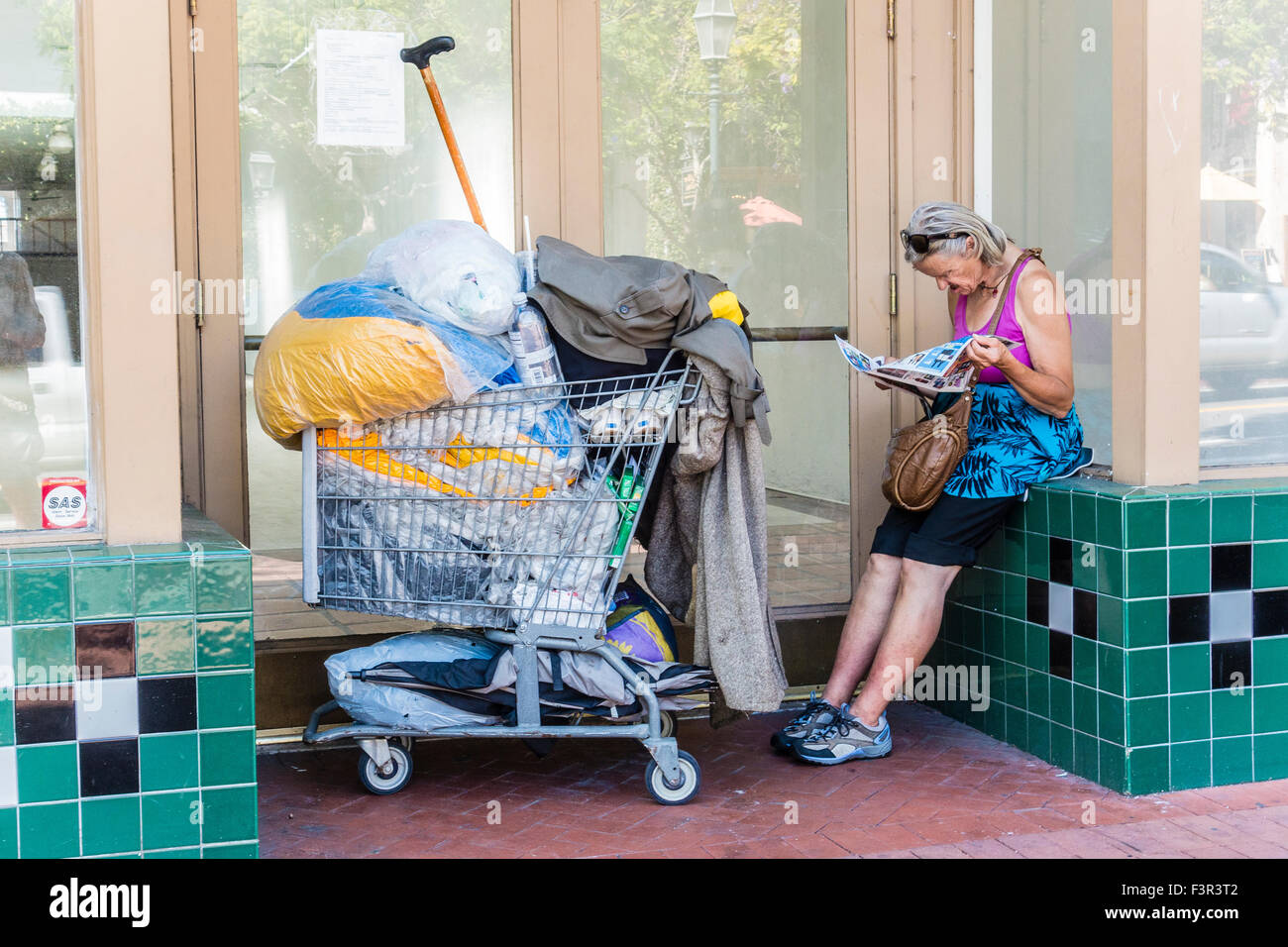 Homeless woman cart hi-res stock photography and images - Alamy