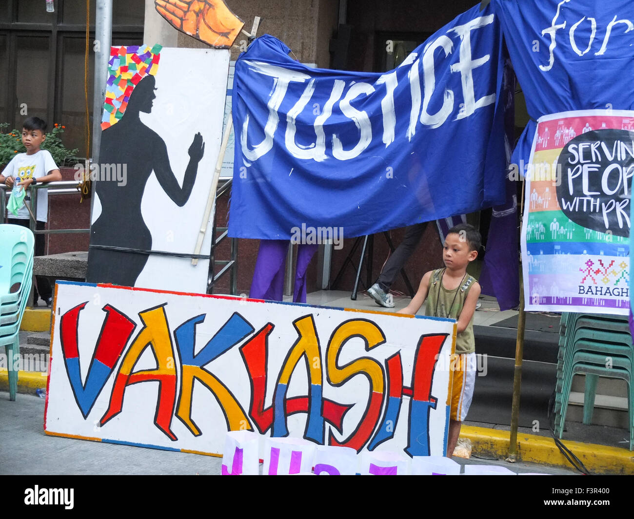 Makati City, Philippines. 11th Oct, 2015. A young boy holding a large ...