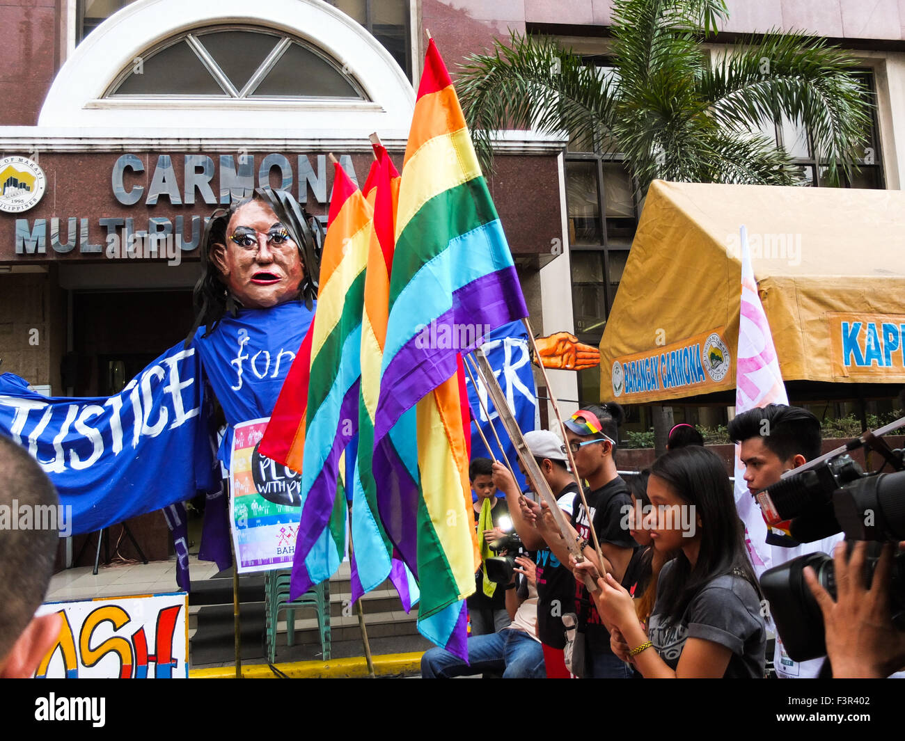 Makati City, Philippines. 11th Oct, 2015. Supporters carrying the LGBT ...