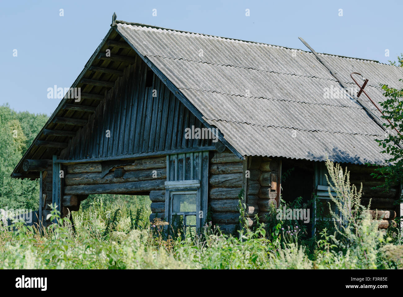 Destroyed wooden house in village Stock Photo - Alamy