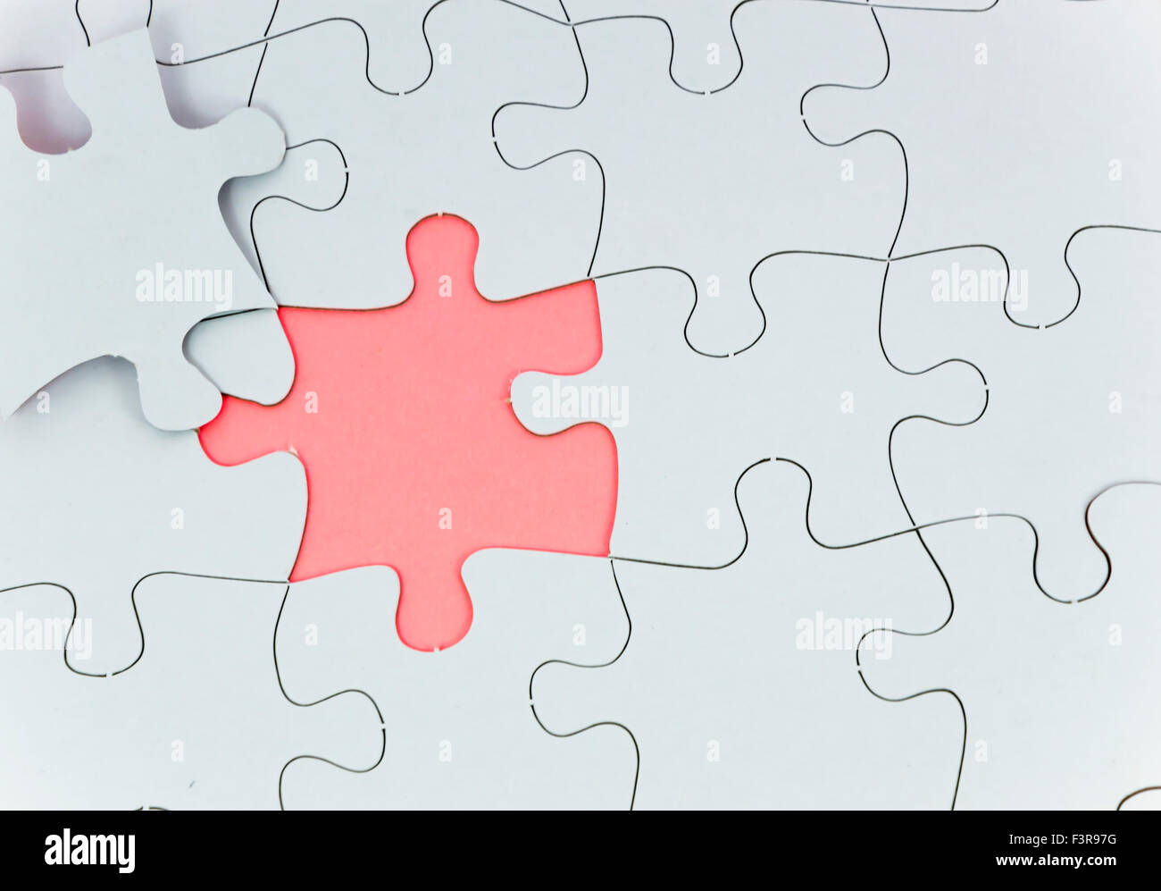 Plain white jigsaw puzzle, on Red background Stock Photo - Alamy