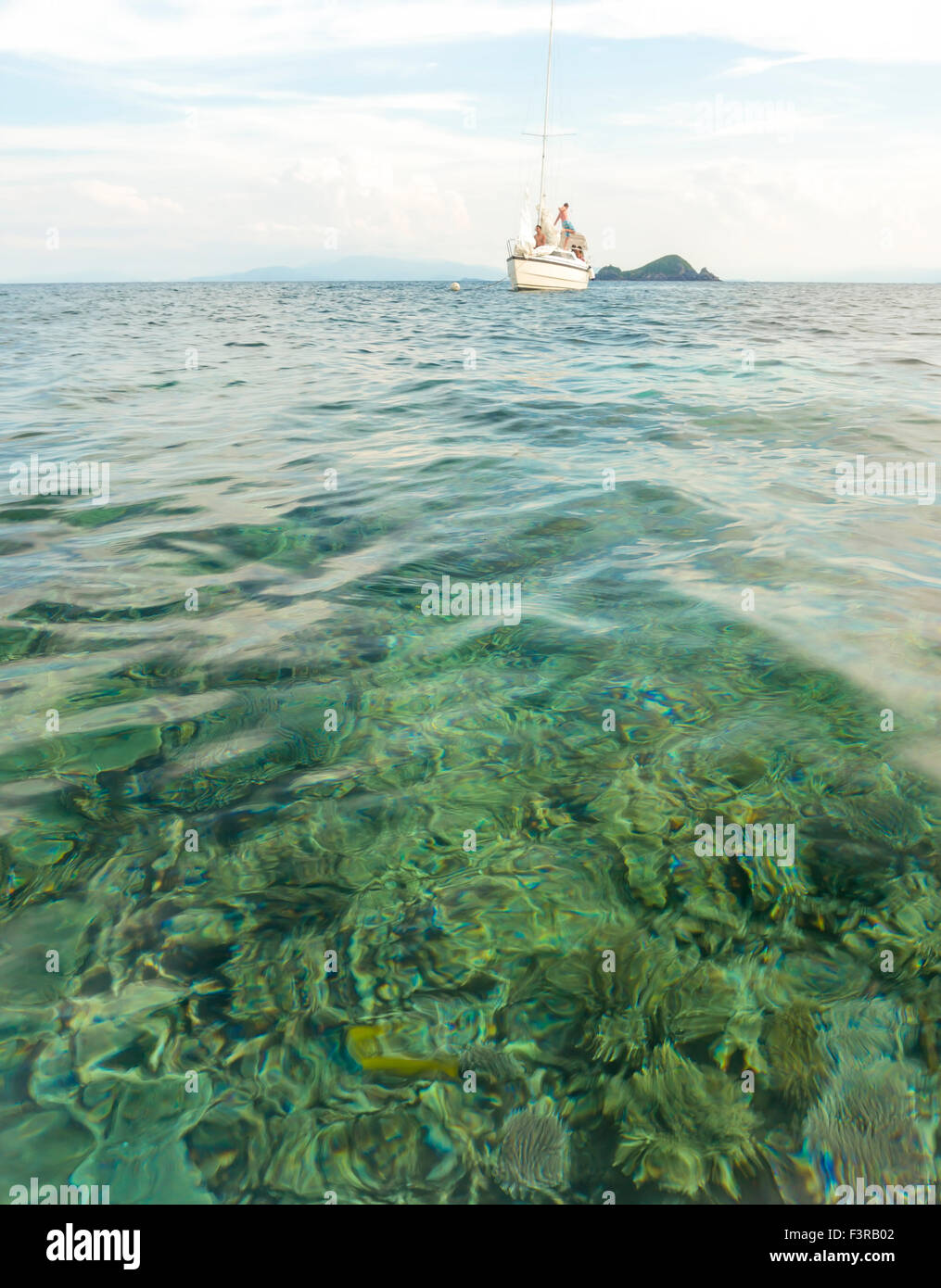 Clean and clear water with sail boats background. Low angle view Stock ...