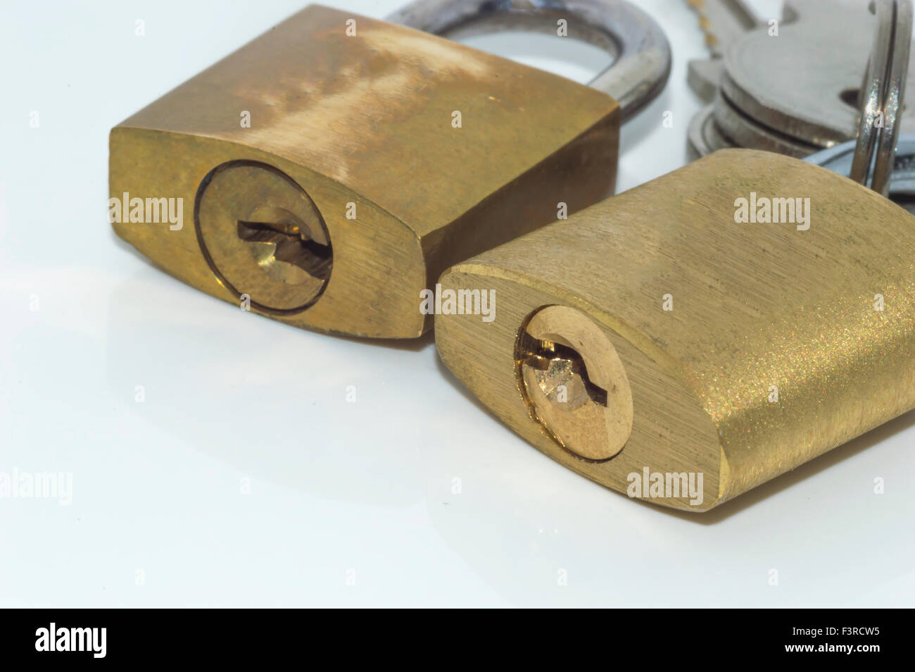 Padlock and key with white background Stock Photo - Alamy