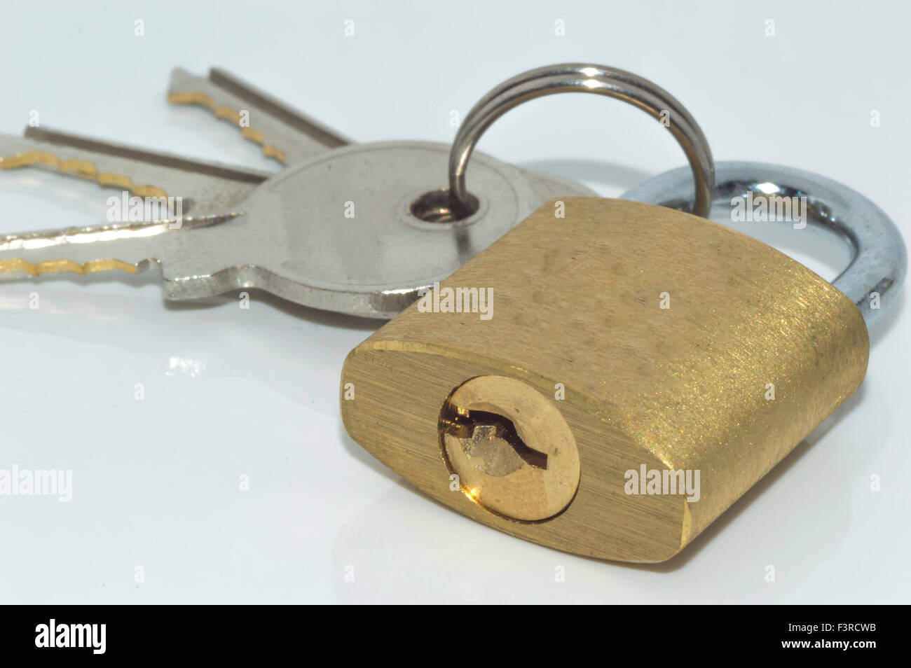 Padlock and key with white background Stock Photo - Alamy