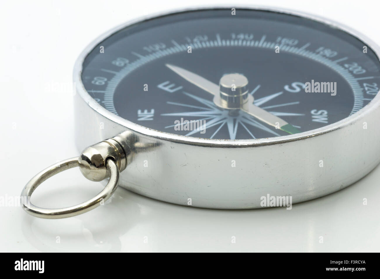 Compass isolated on white with selective focused Stock Photo - Alamy