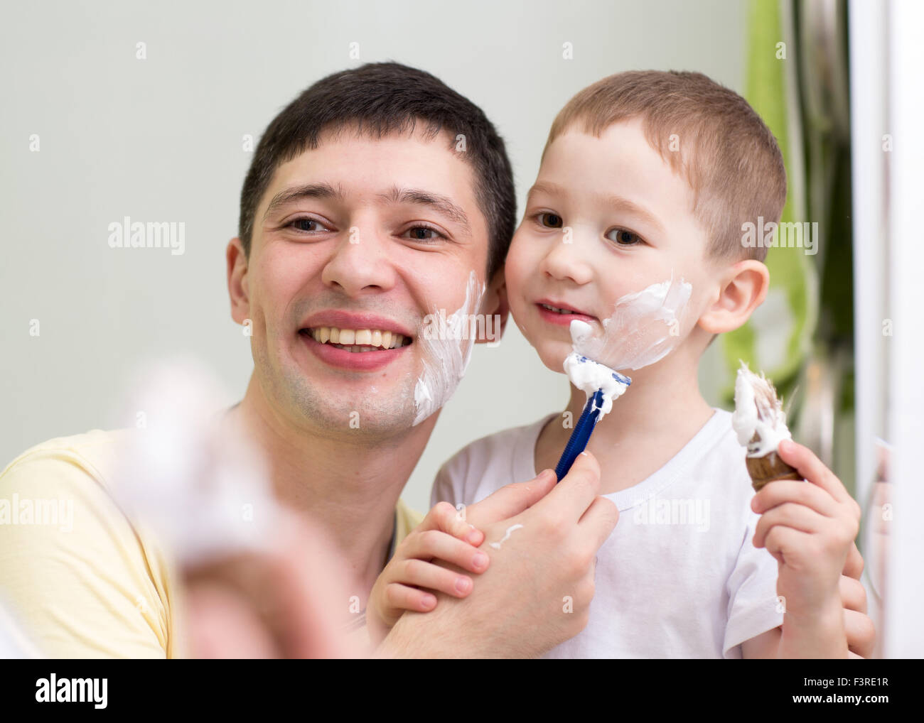 Boy child looking in mirror hi-res stock photography and images - Alamy