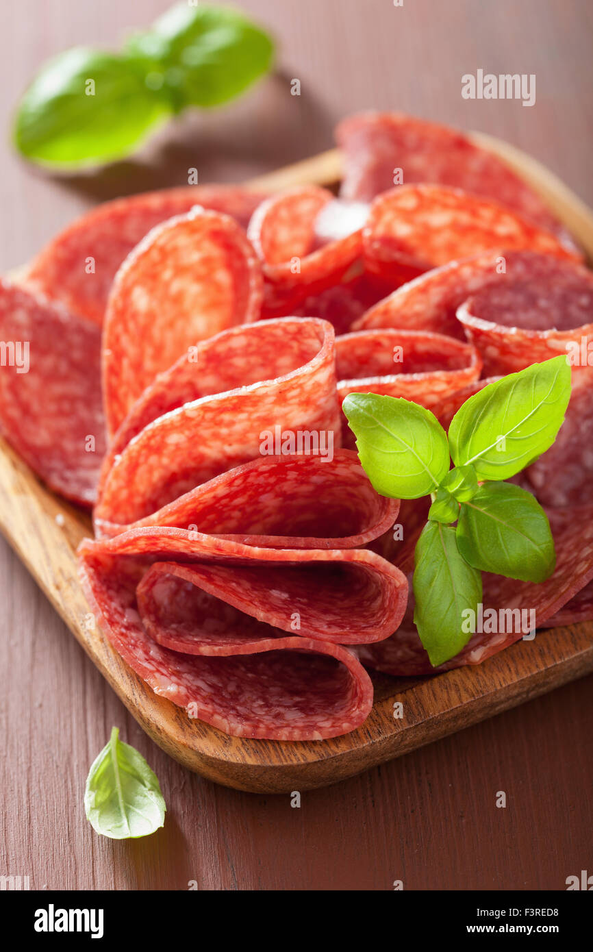 salami slices in wooden plate Stock Photo - Alamy