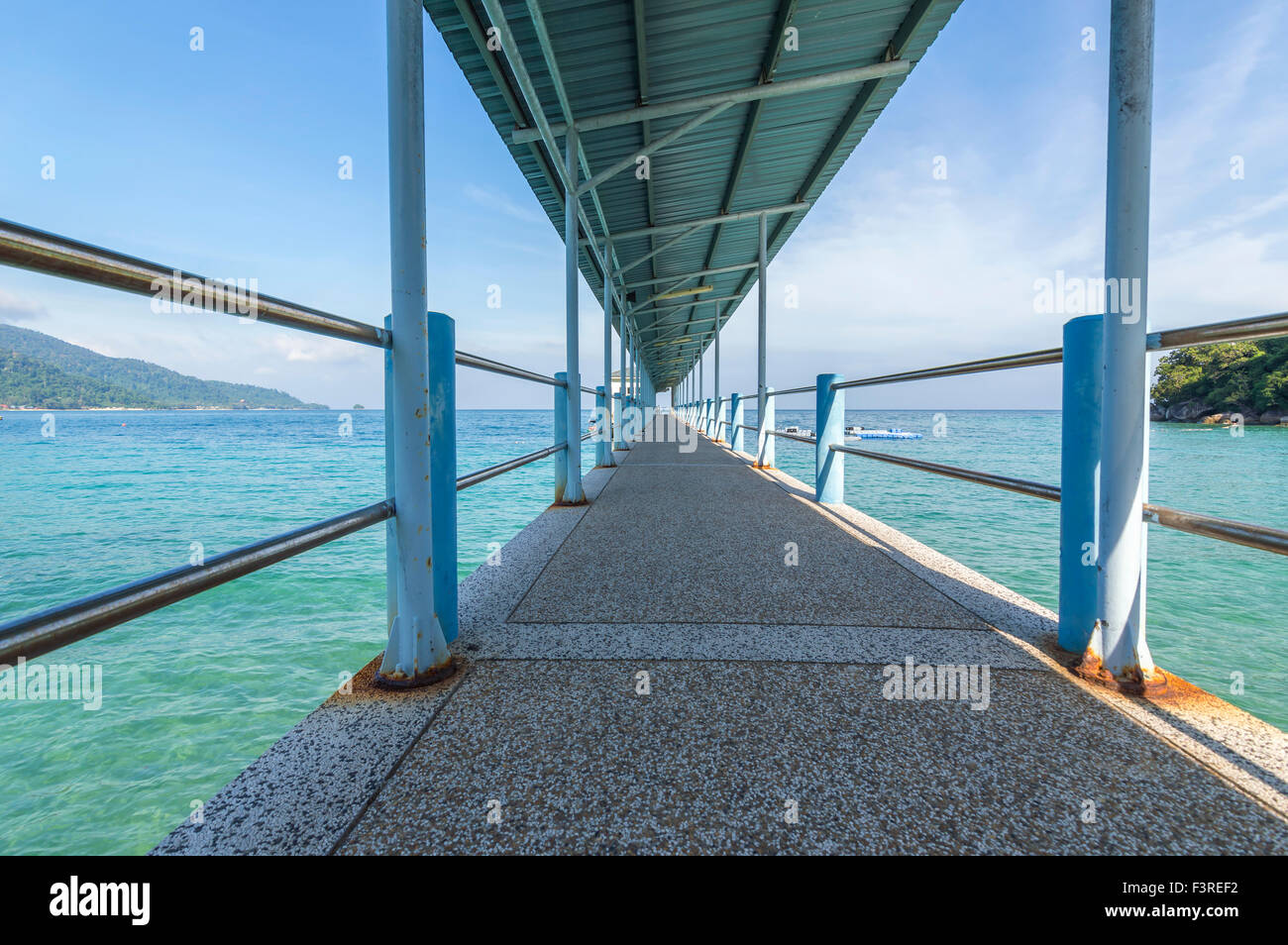 Jetty with green water Stock Photo - Alamy
