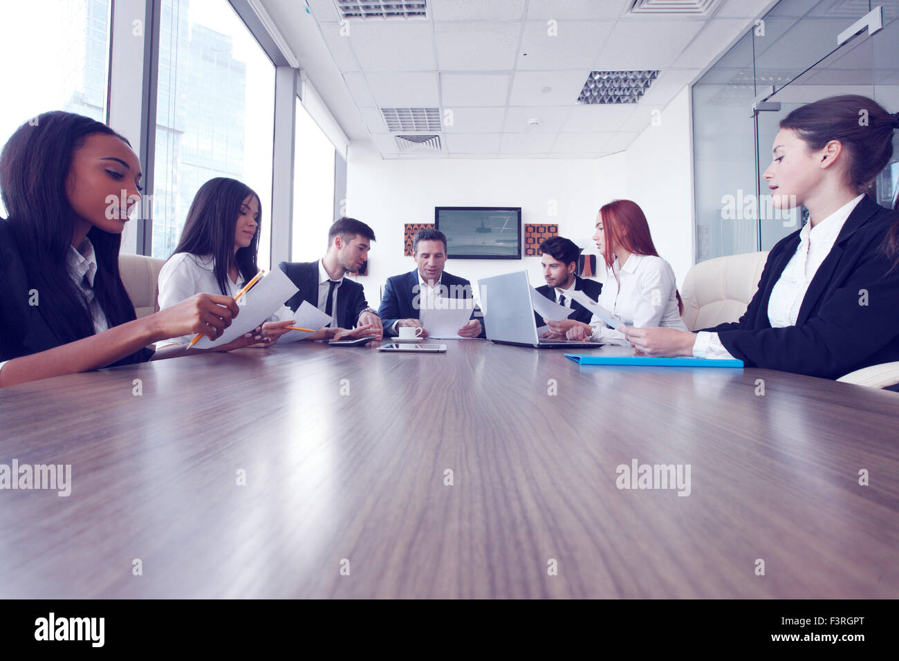 Business meeting of diverse people around the table Stock Photo - Alamy