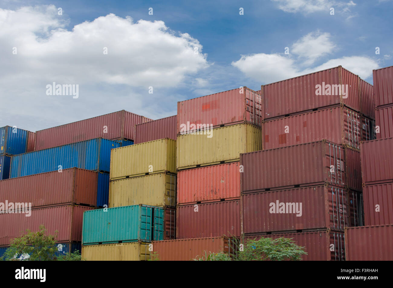 Stacked cargo containers in storage area of freight sea port terminal ...