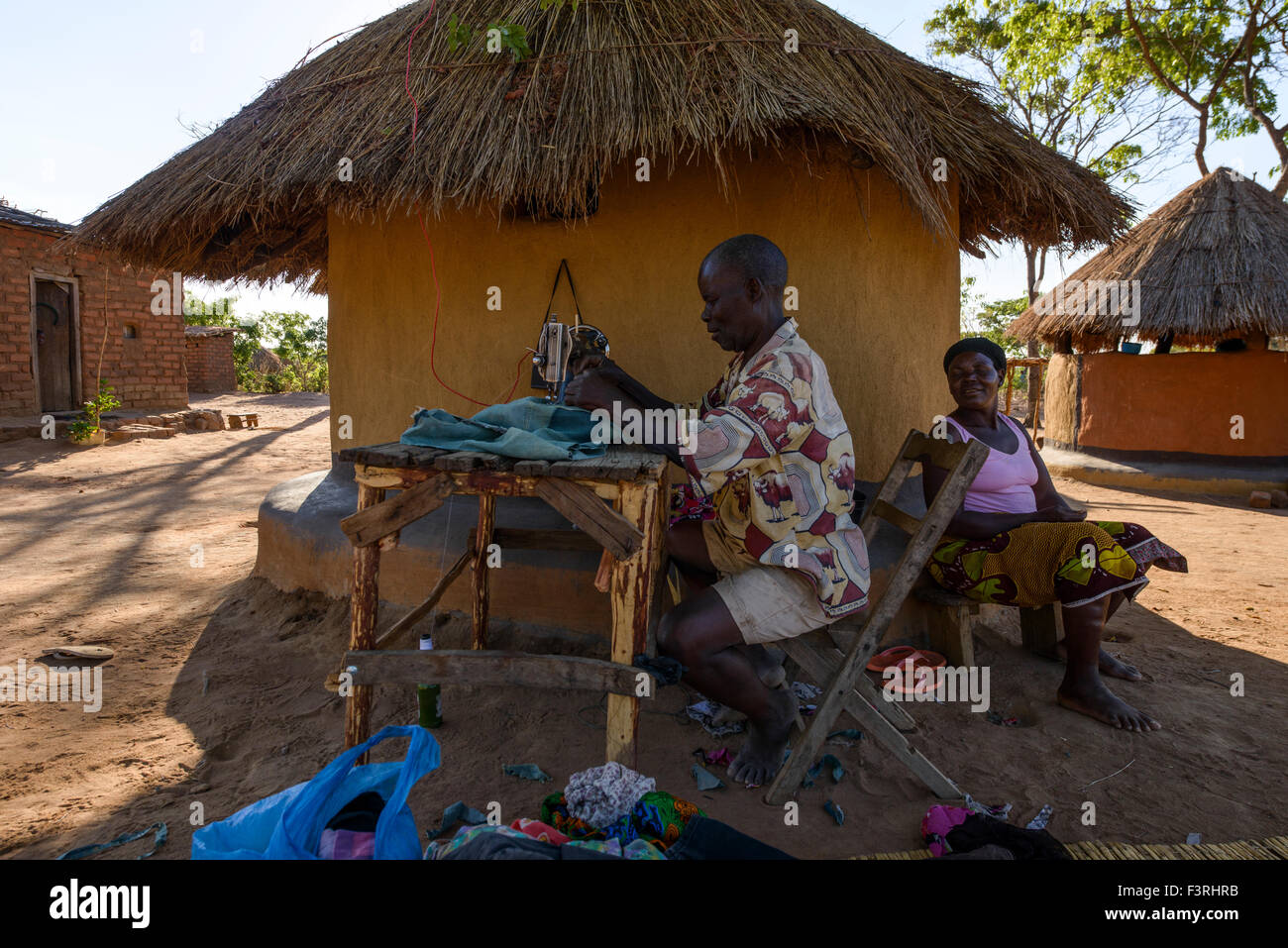 African man and hut hi-res stock photography and images - Alamy