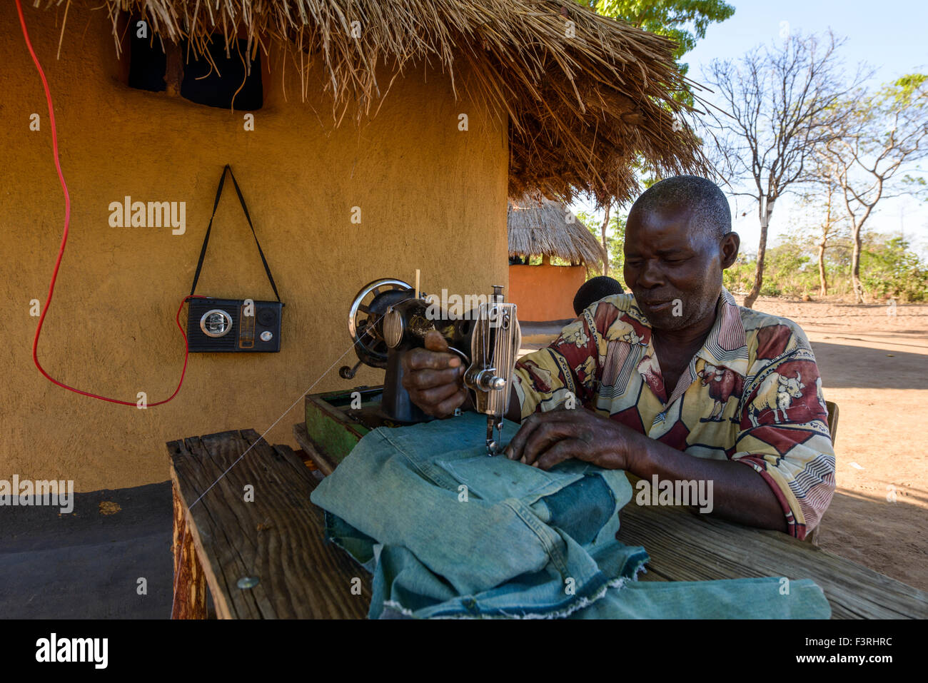 African man and hut hi-res stock photography and images - Alamy