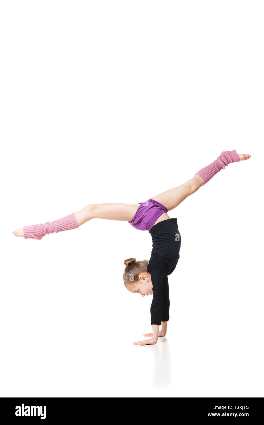 pretty little girl doing gymnastics over white background Stock Photo ...