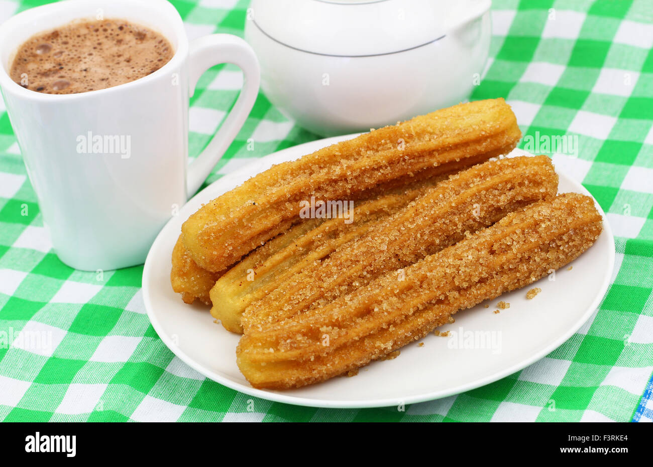 Spanish churros on plate and cup of hot chocolate Stock Photo - Alamy