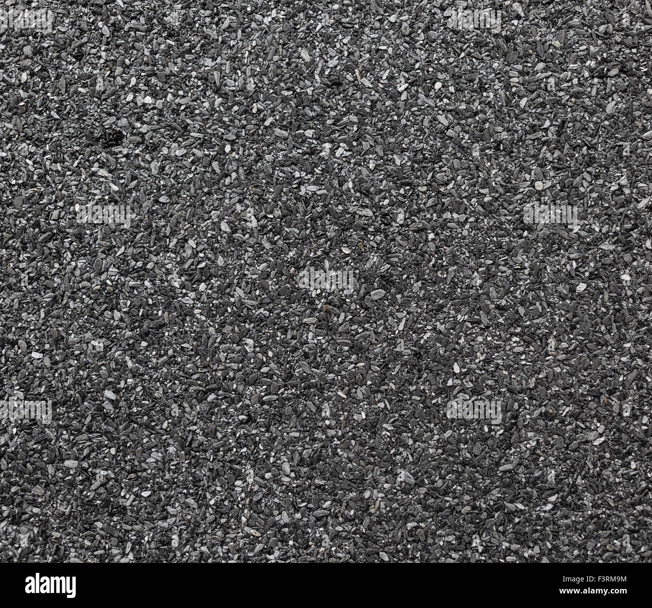 Abstract dark granular background. Close-up abrasive texture roofing ...