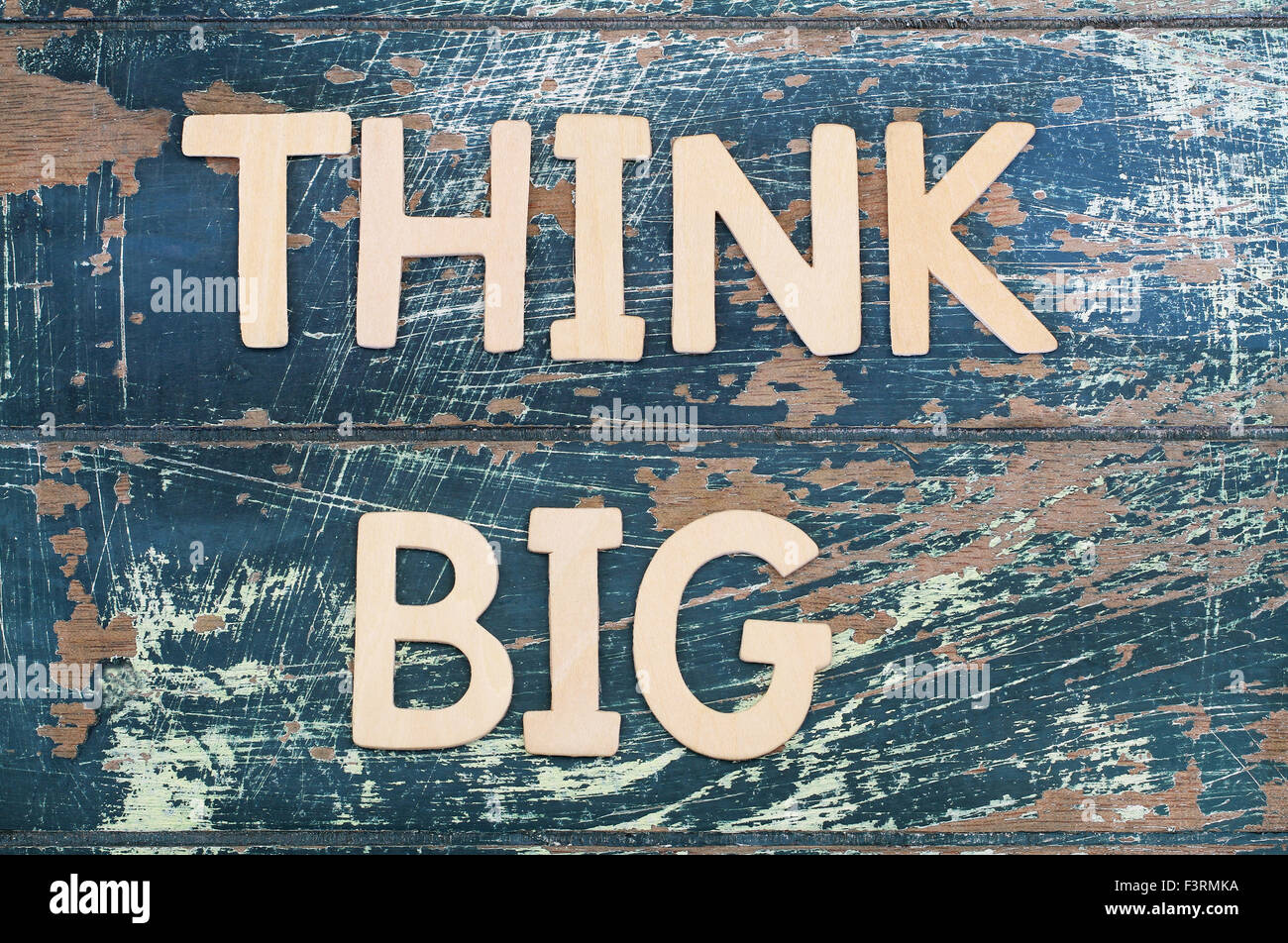 Think big written on rustic wooden surface Stock Photo - Alamy