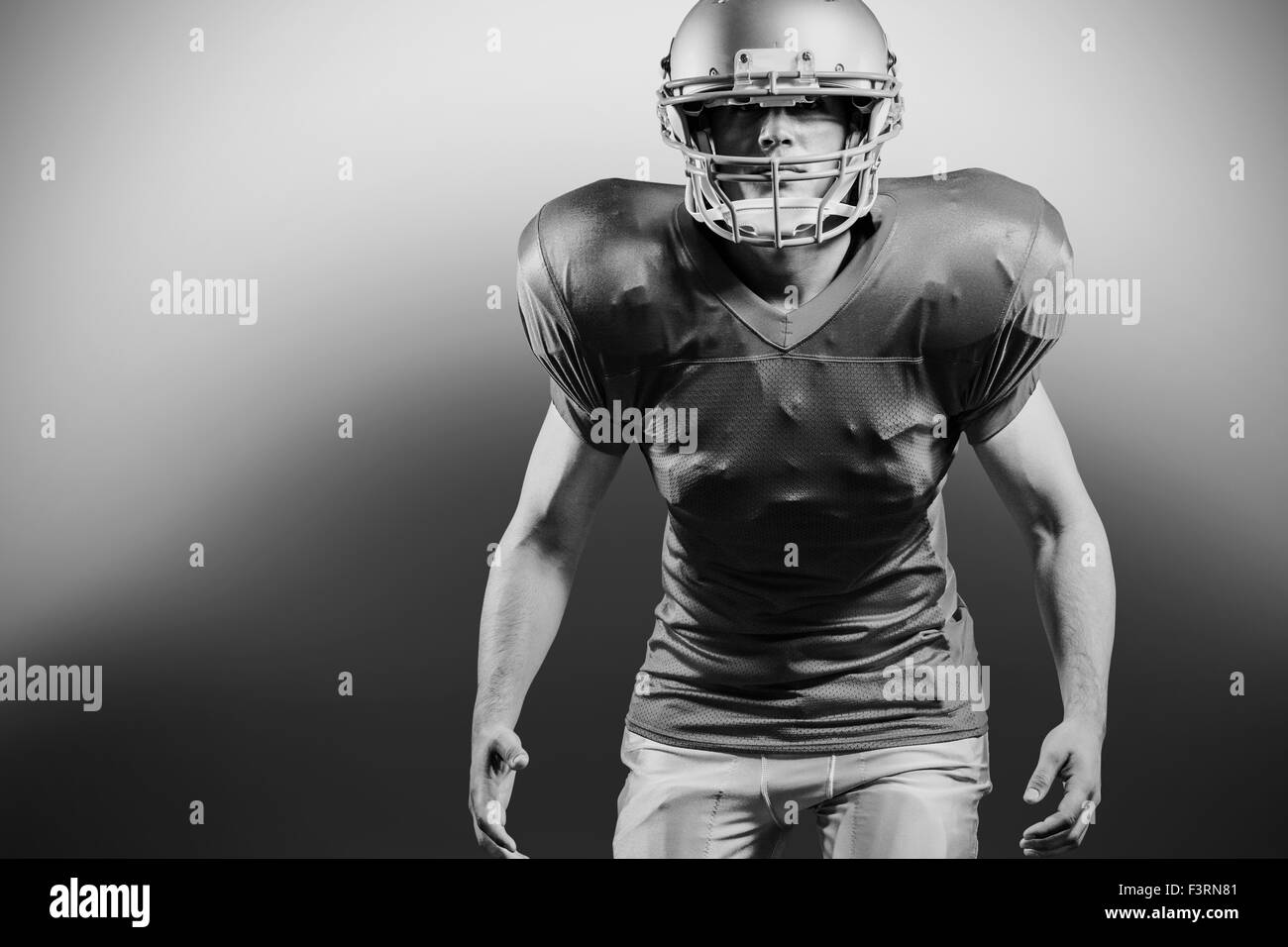 American football player standing in position Stock Photo - Alamy