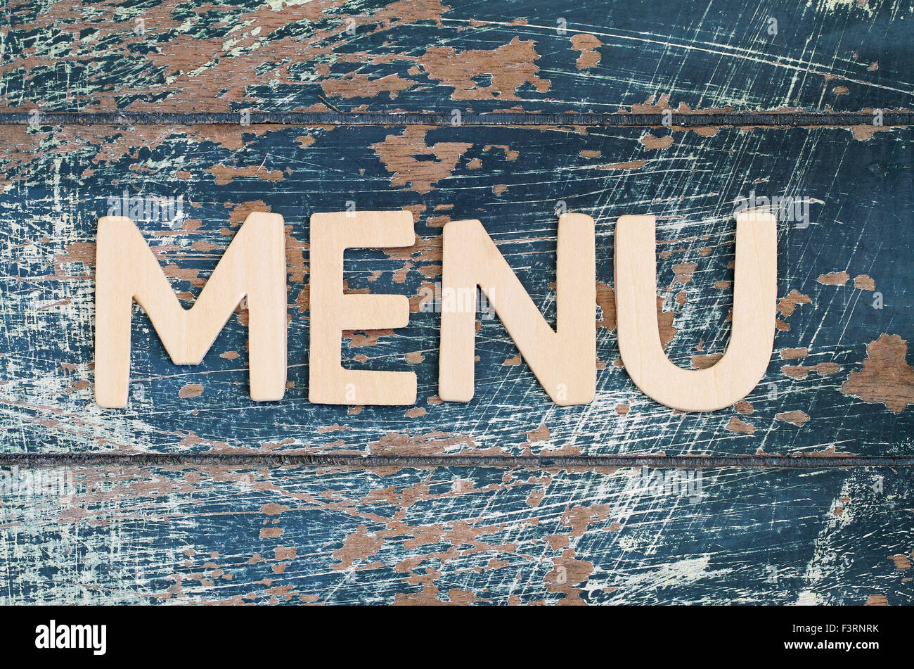 Word menu written on rustic wooden surface Stock Photo - Alamy