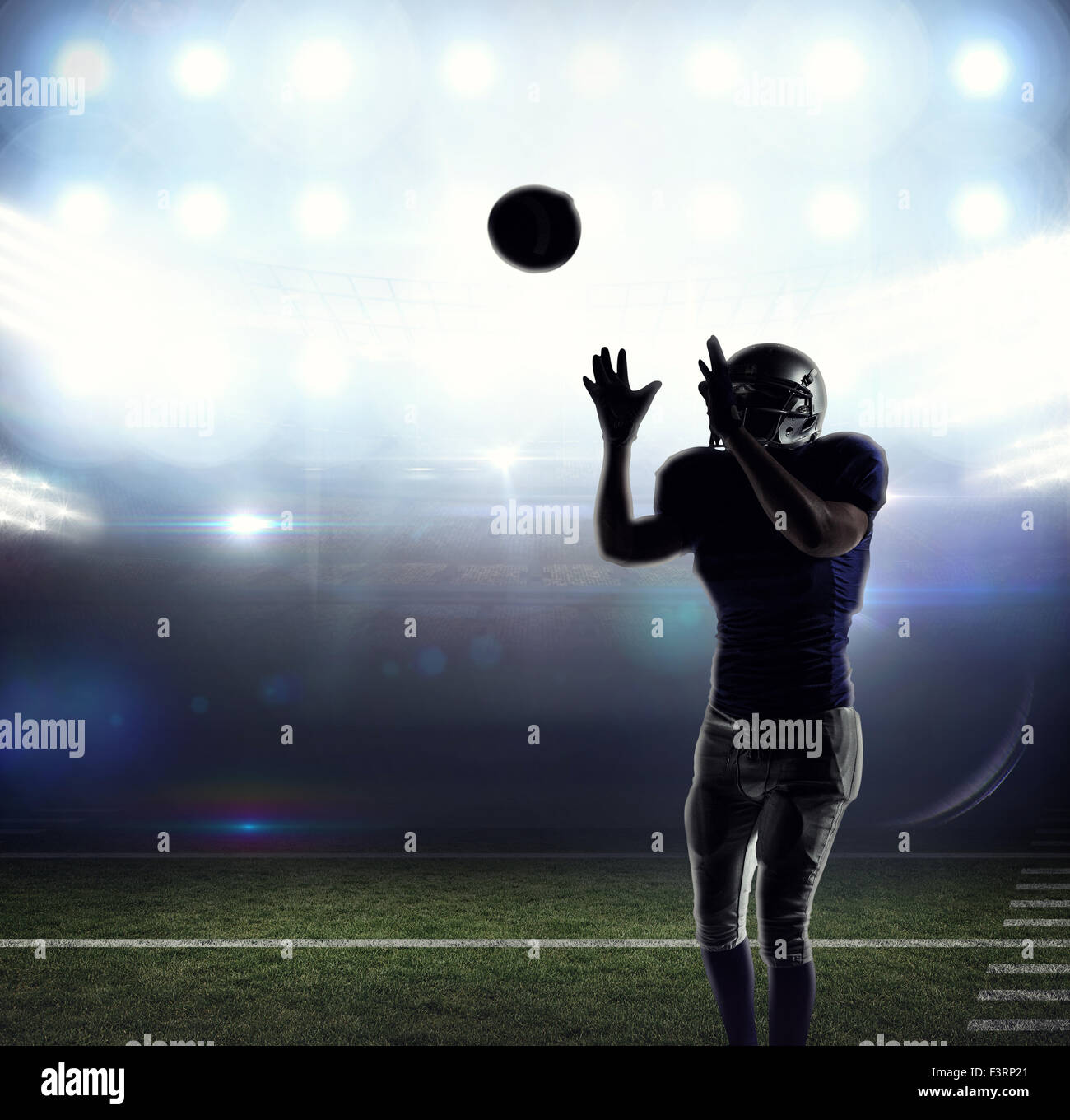 Composite image of american football player catching ball Stock Photo ...