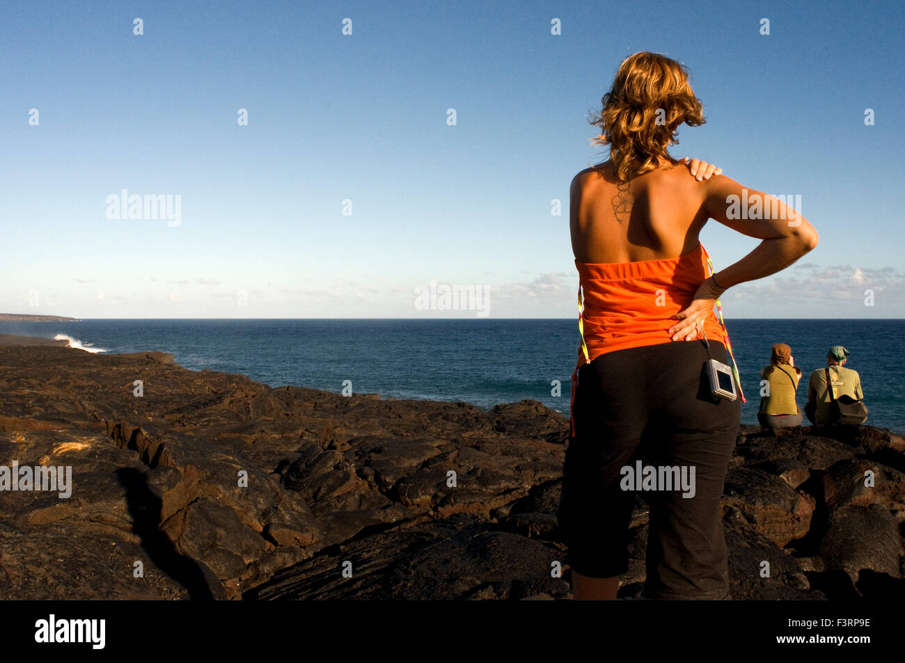 Black lava mountains near the coast and highway Chain of Crater Road ...