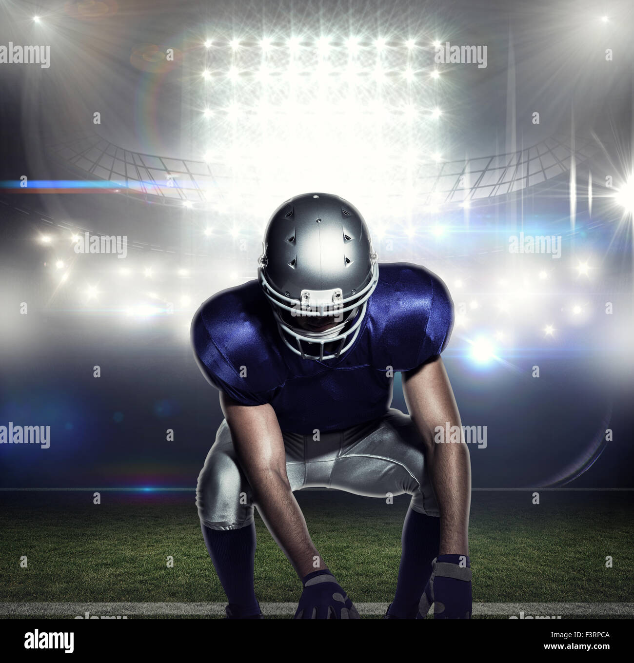 Composite image of american football player holding ball while ...