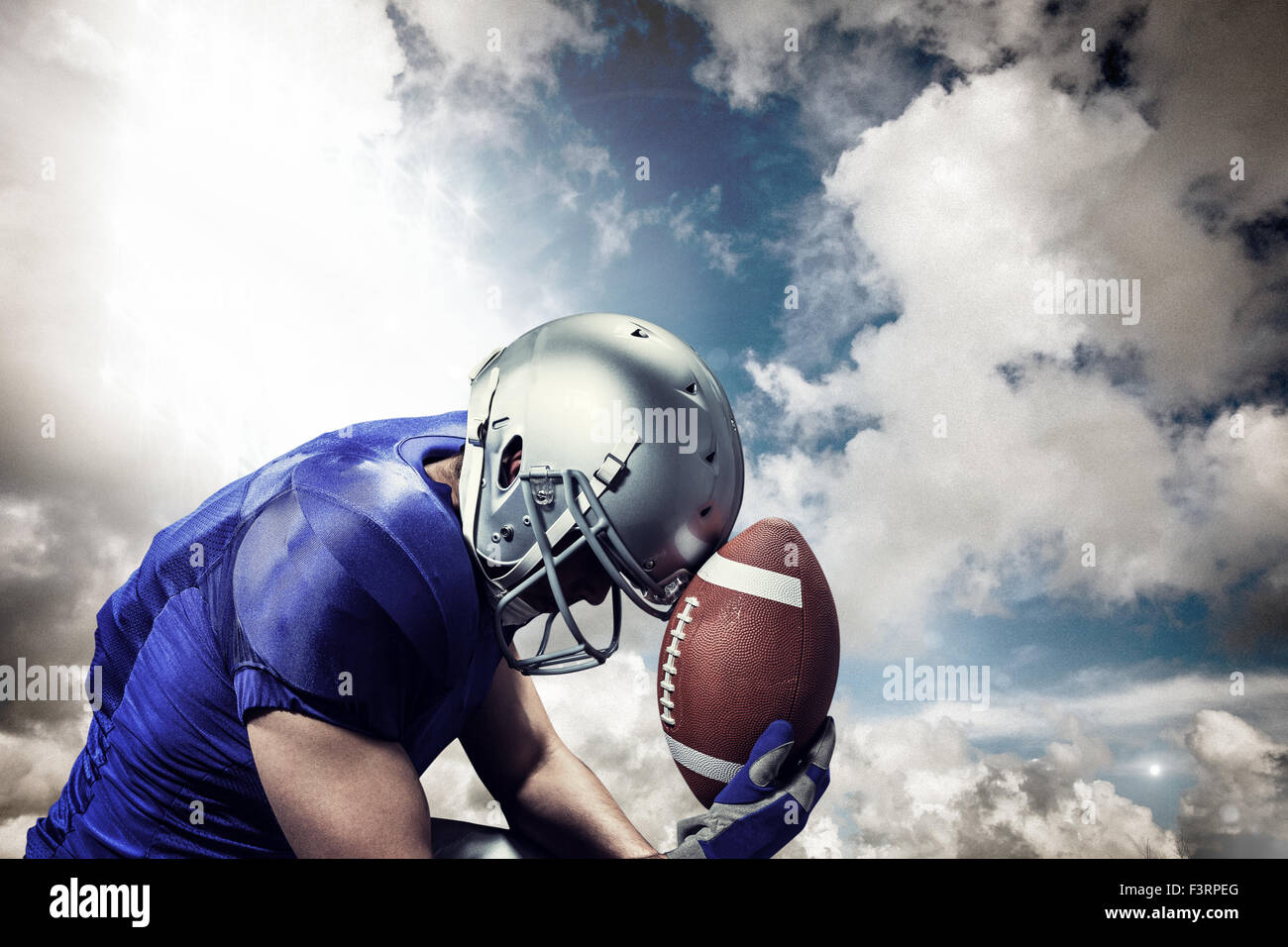 Composite image of upset american football player with ball Stock Photo ...