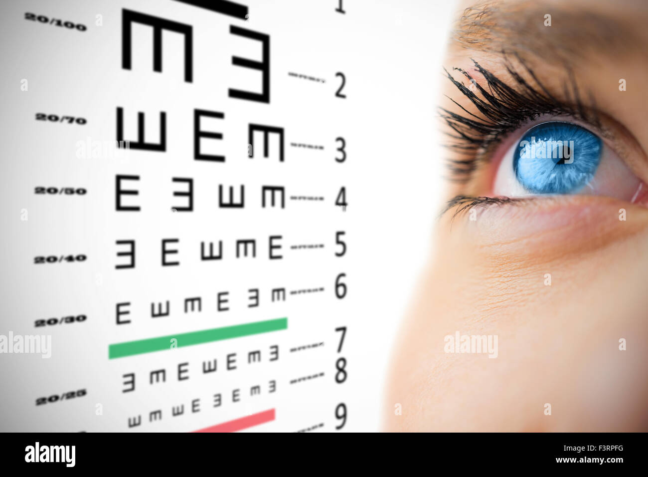 Composite image of blue eye looking up on female face Stock Photo - Alamy