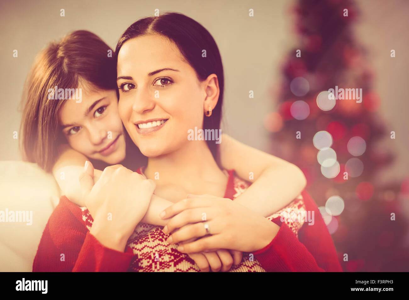 Festive mother and daughter smiling at camera Stock Photo - Alamy Festive mother and daughter smiling at camera Stock Photo - Alamy