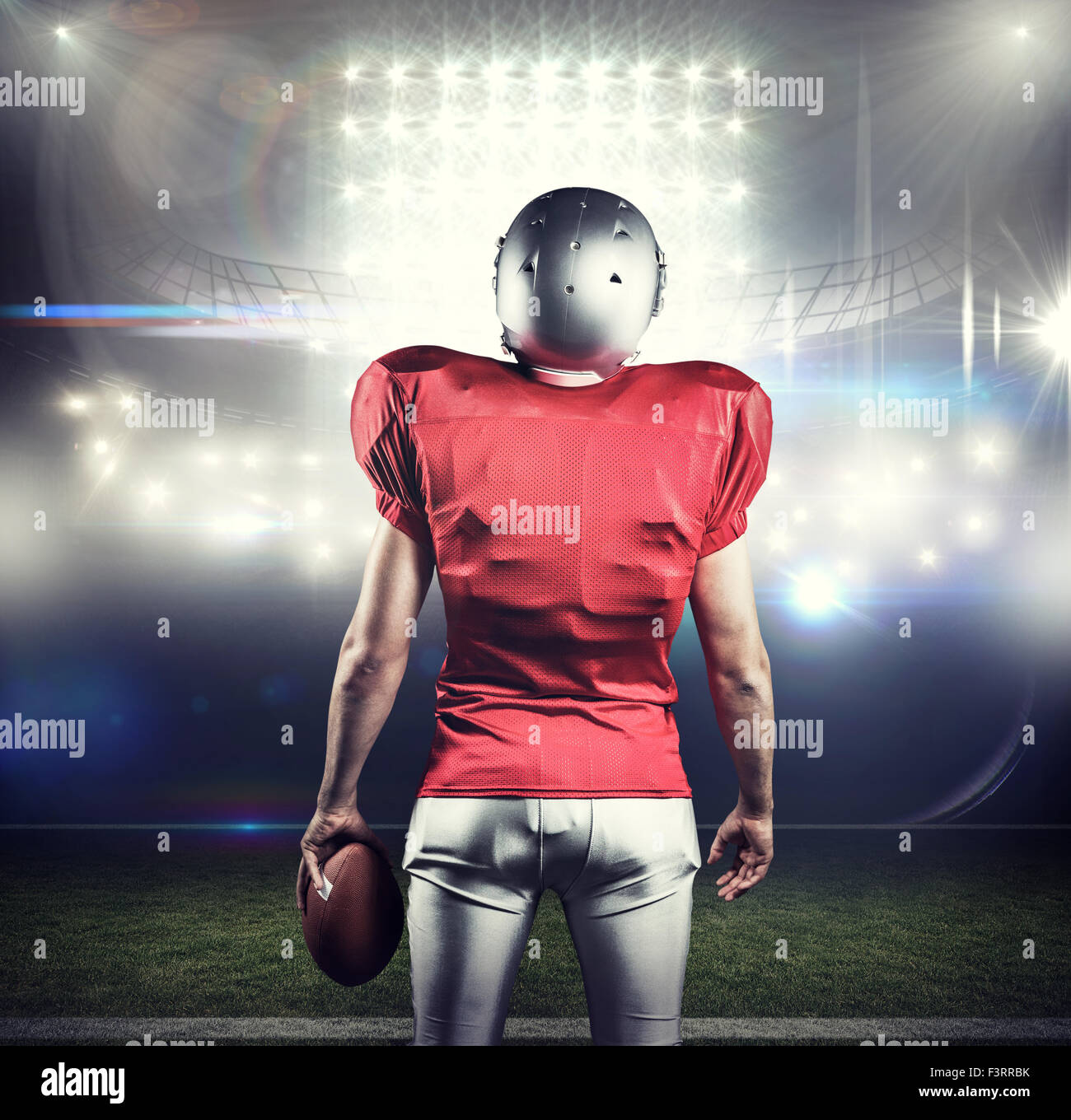 Composite image of rear view of american football player with ball ...