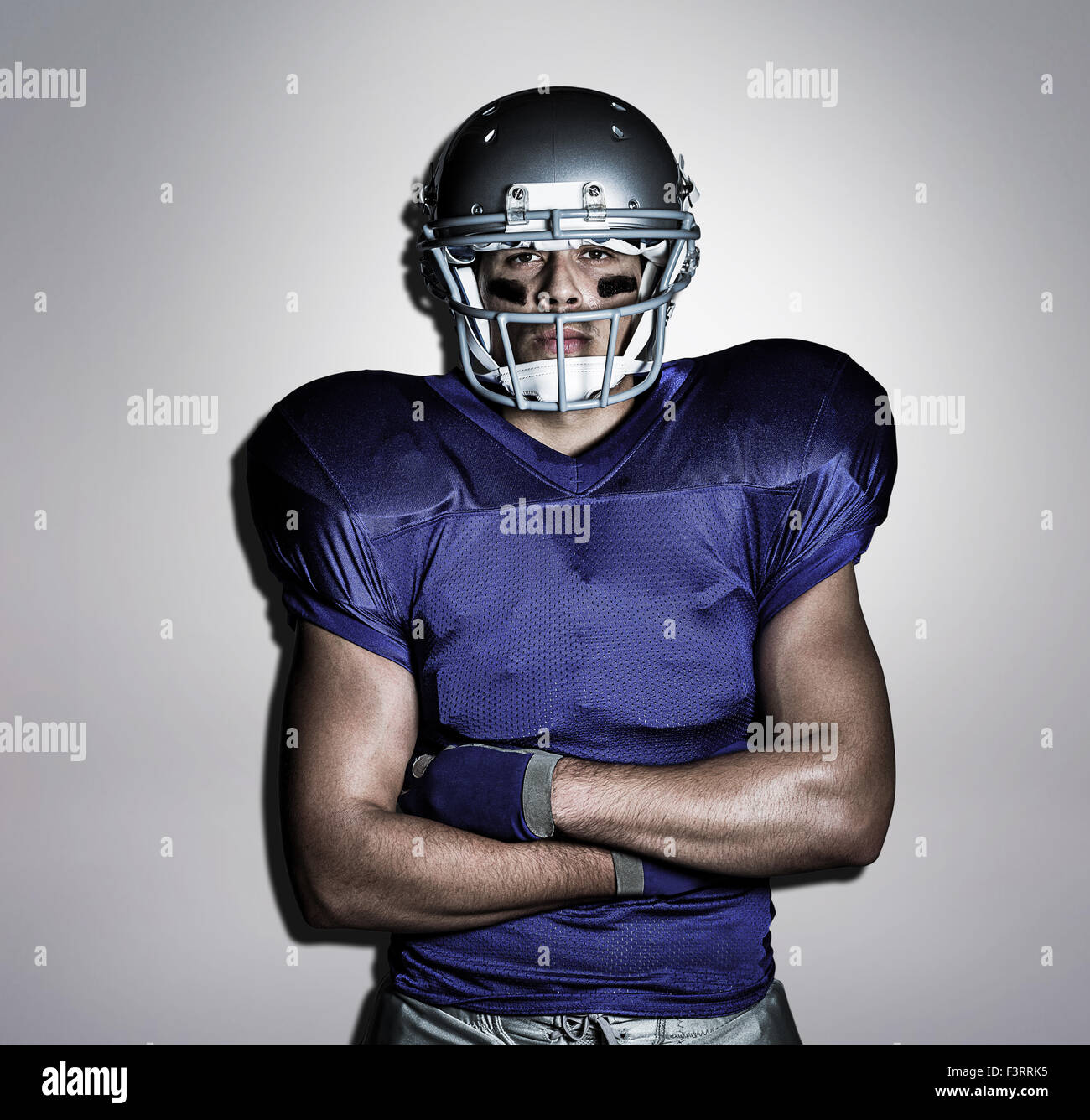 Composite image of portrait of determined american football player with ...