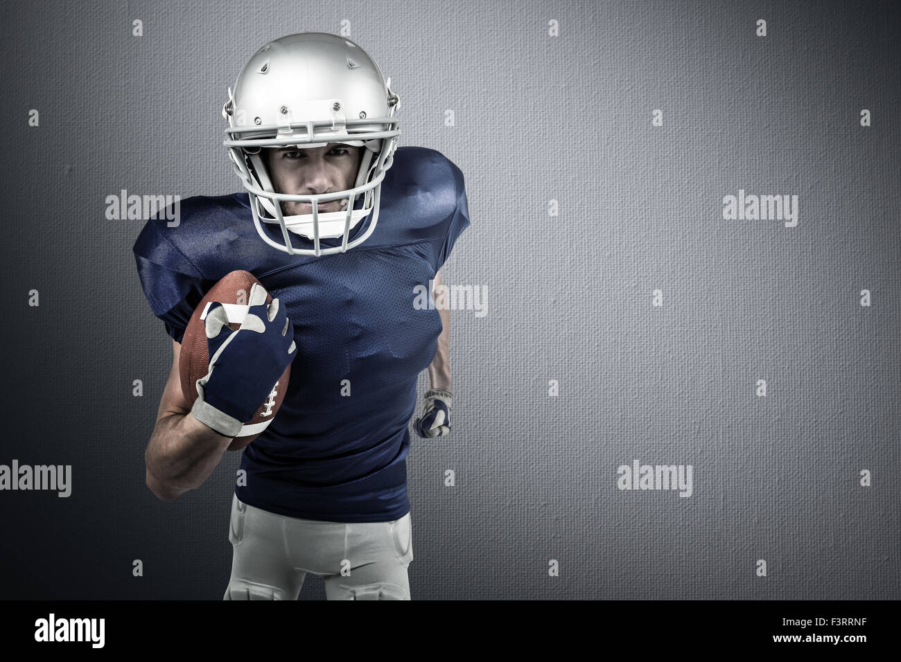 Football player running the ball hi-res stock photography and images ...