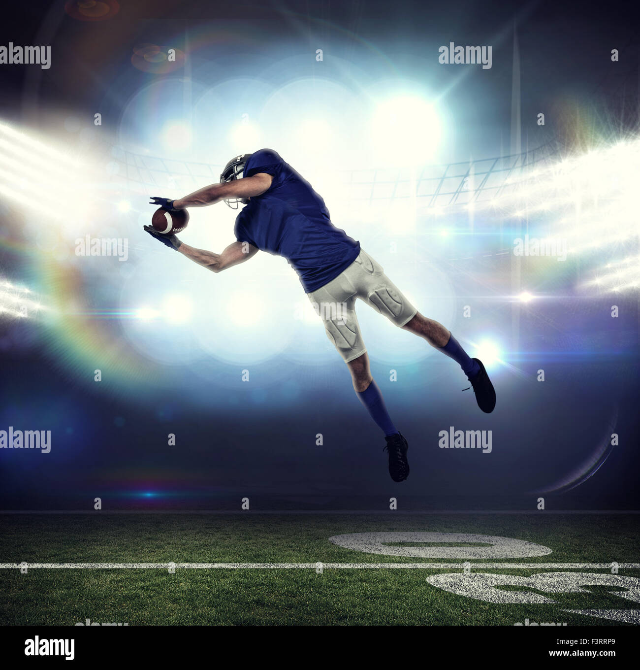American football player catching ball hi-res stock photography and ...