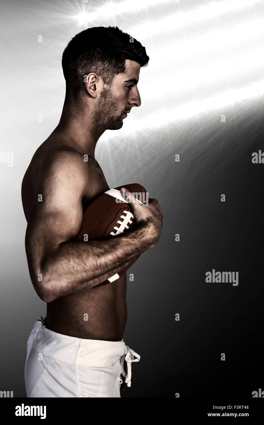 Composite image of side view of shirtless man holding ball Stock Photo ...