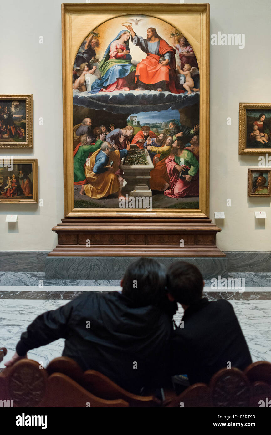 Rome. Italy. Visitors admiring the Coronation of the Virgin (1505-1525), aka Madonna di ...