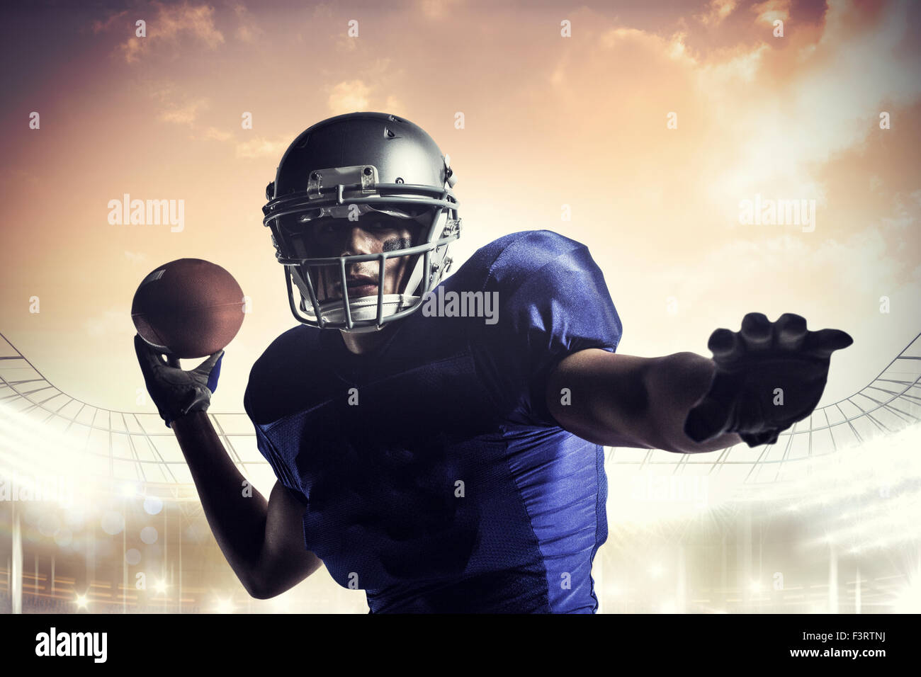 Composite image of sportsman playing football Stock Photo - Alamy