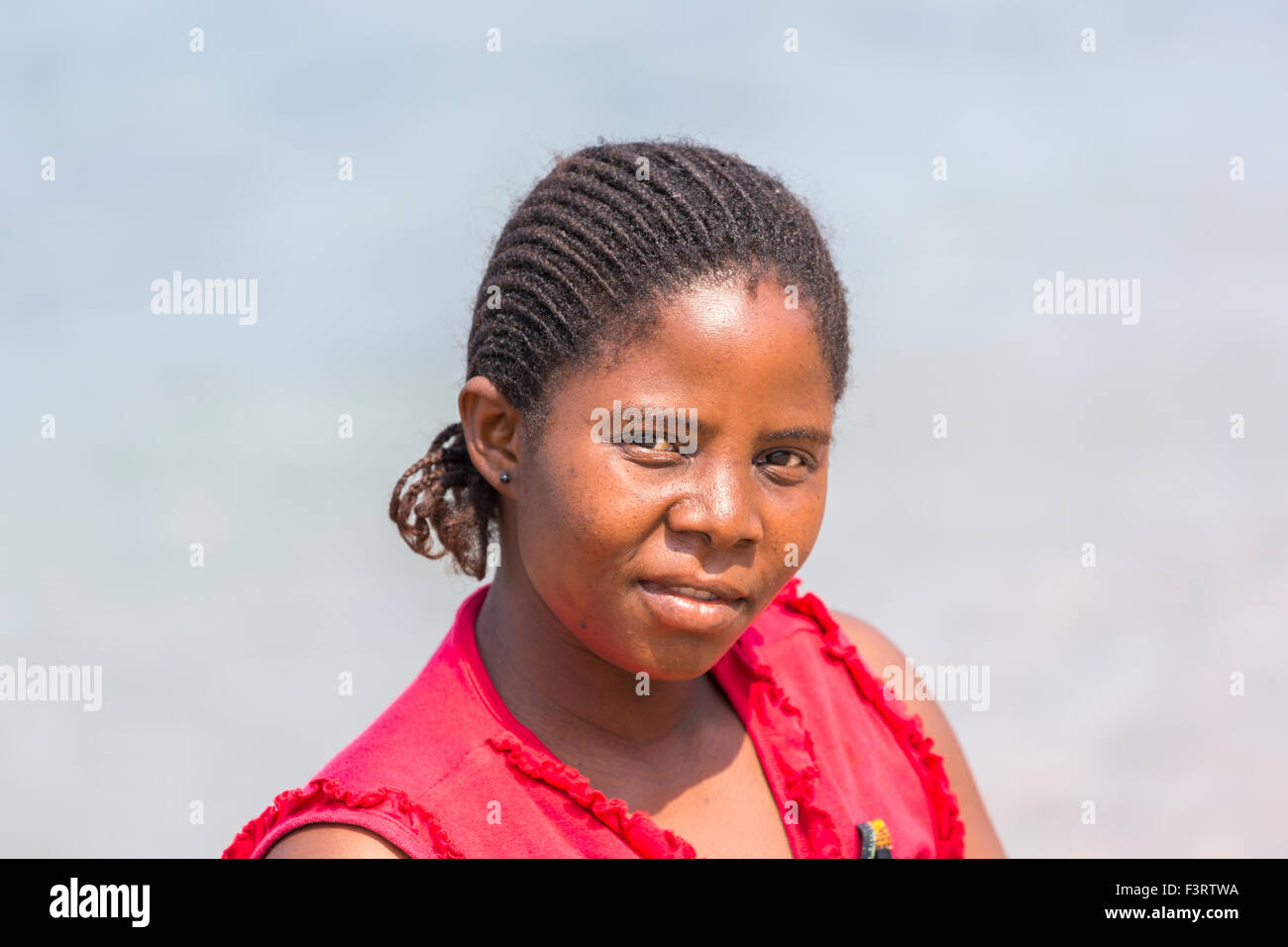 Head and shoulders portrait of a local young African Malawian woman ...