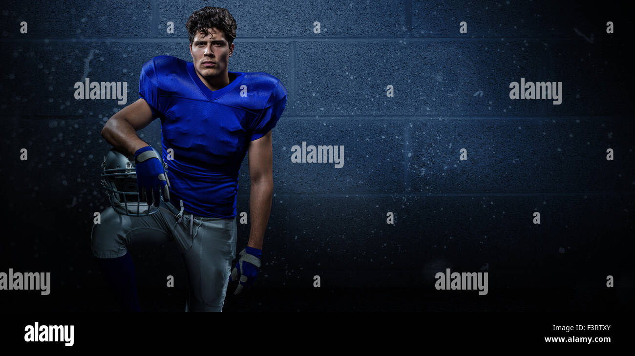 Composite image of portrait of determined american football player with ...