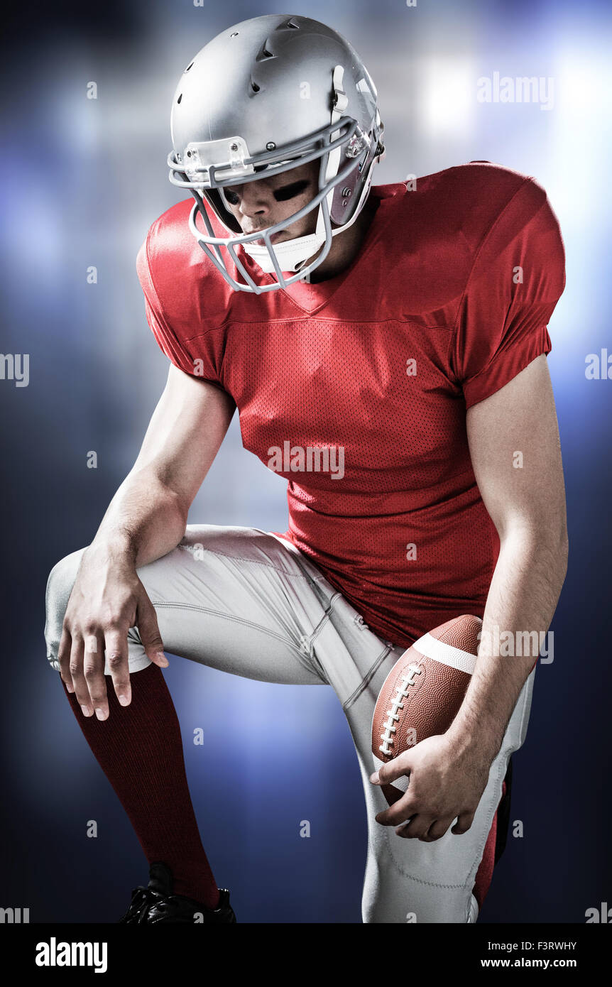 Composite image of american football player with hand on knee Stock ...