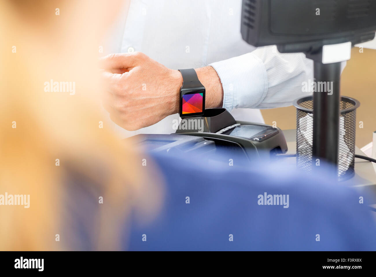 Midsection Of Customer Paying Through Smartwatch In Pharmacy Stock ...