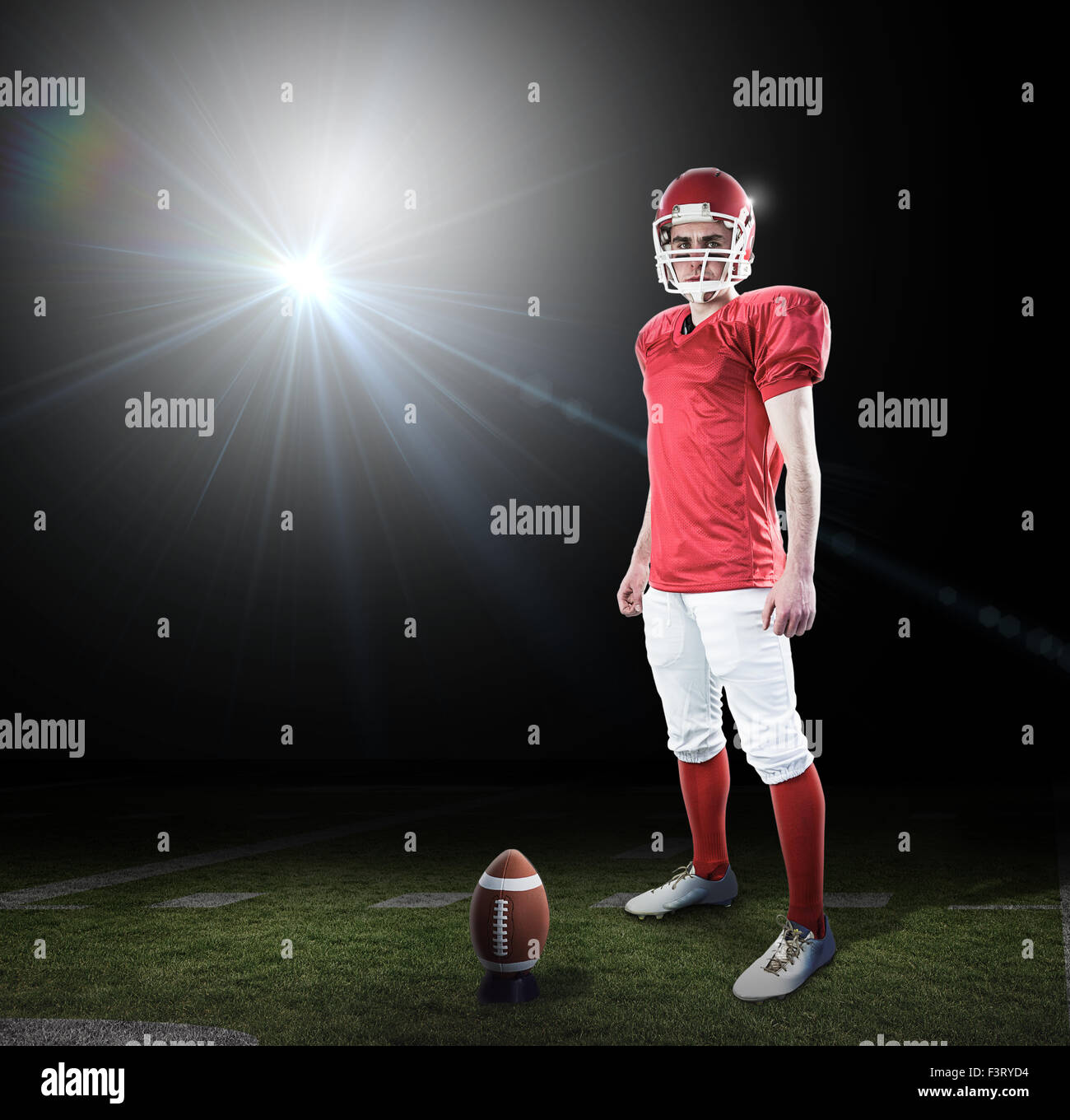 Composite image of a serious american football player taking his helmet ...