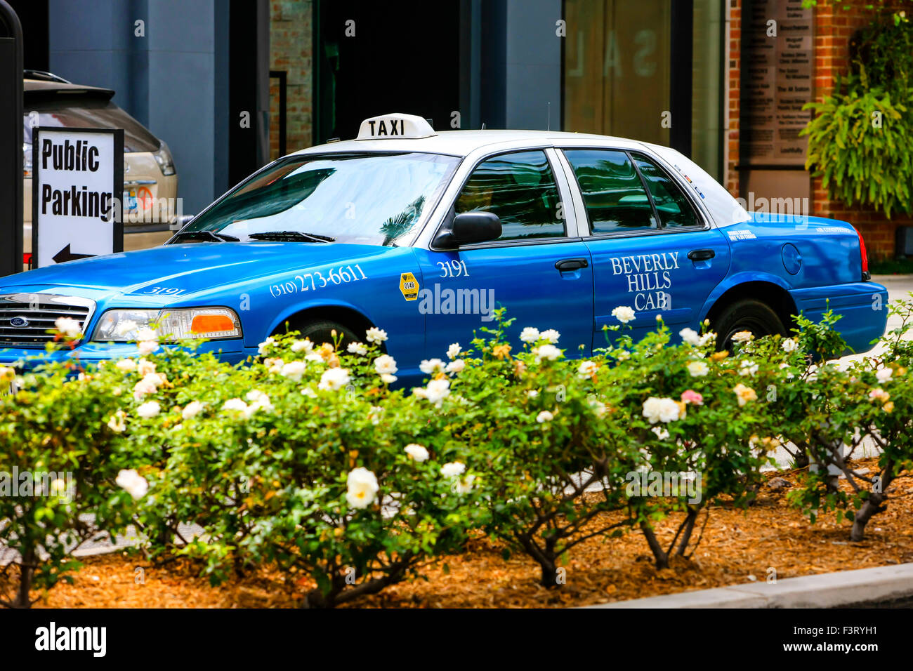 Blue and white Beverly Hills Cab on Rodeo Drive in California Stock ...
