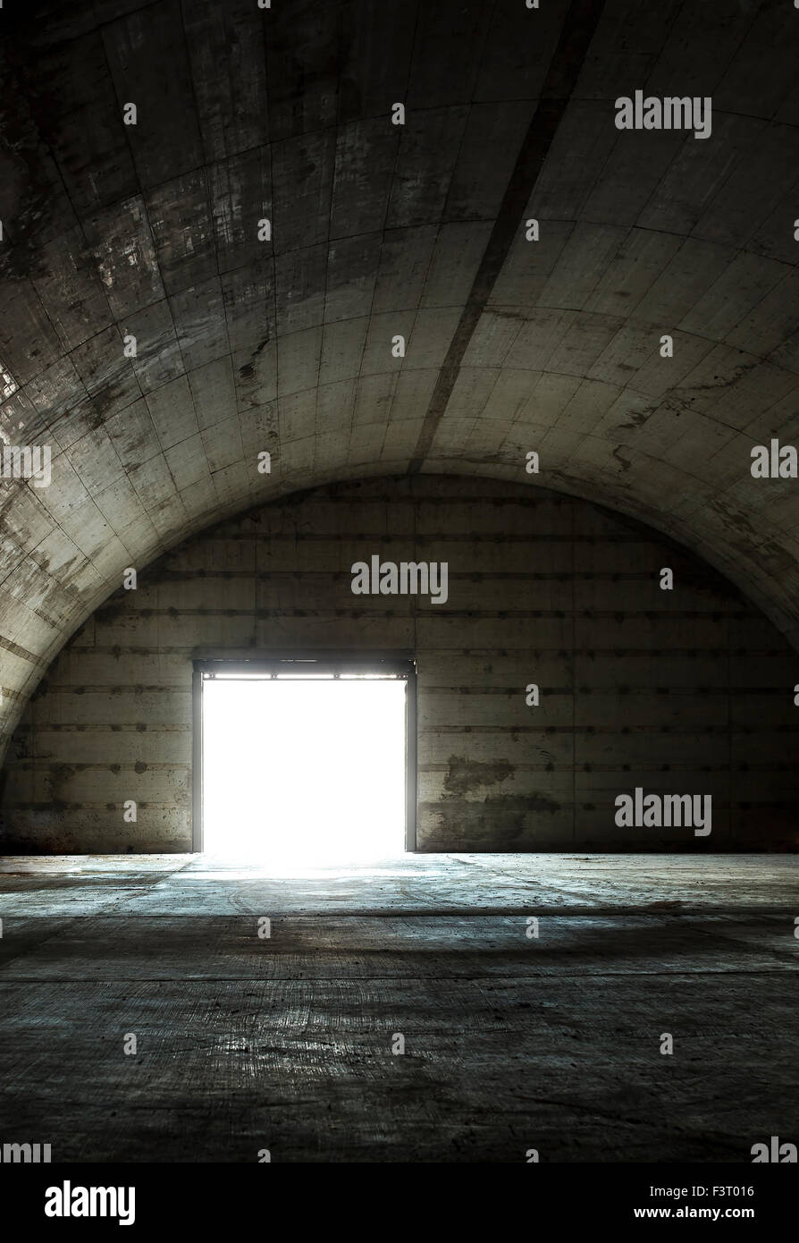 Old military hangar used to storage stuff Stock Photo - Alamy