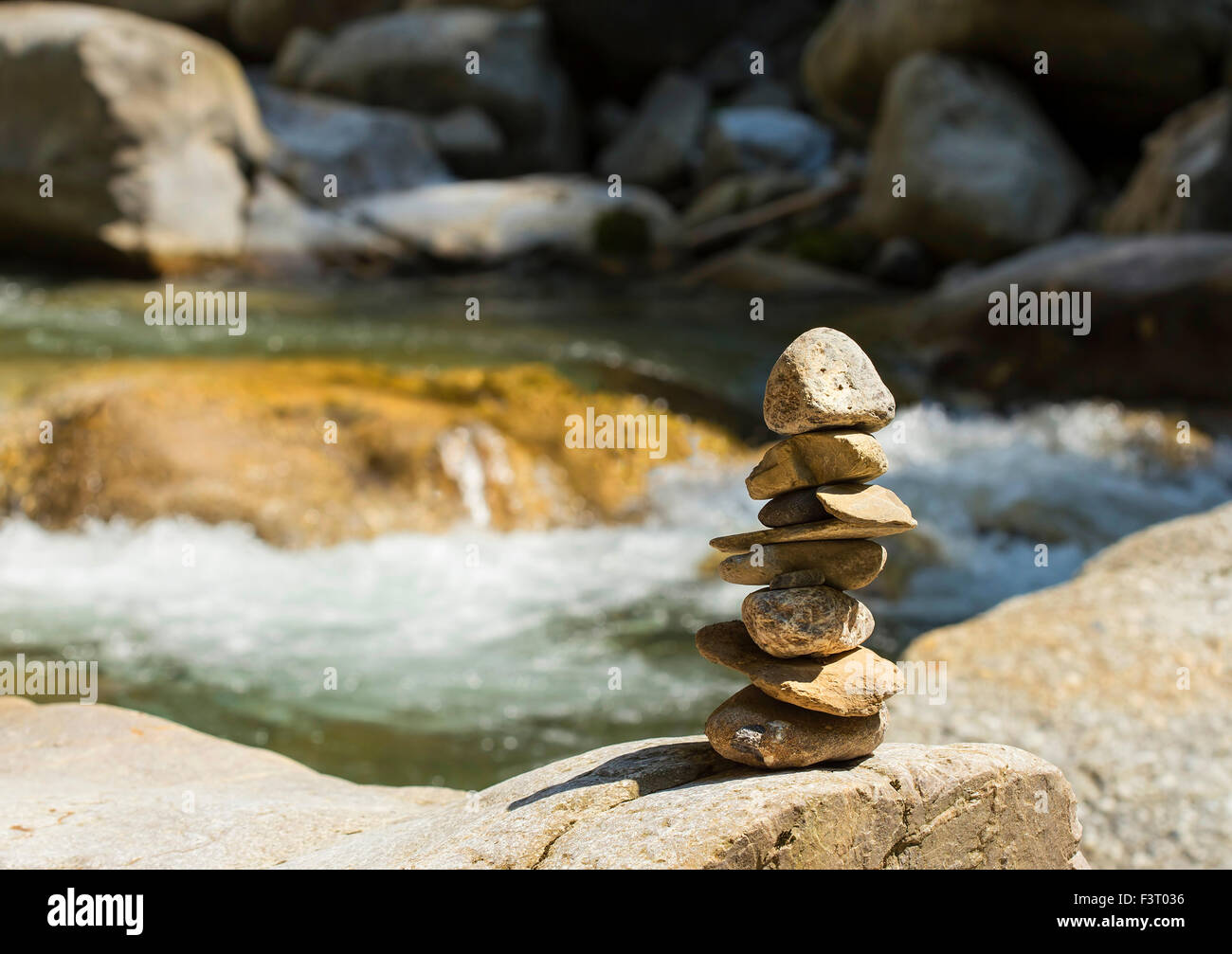 Stacked rock tower in nature, man made Stock Photo - Alamy