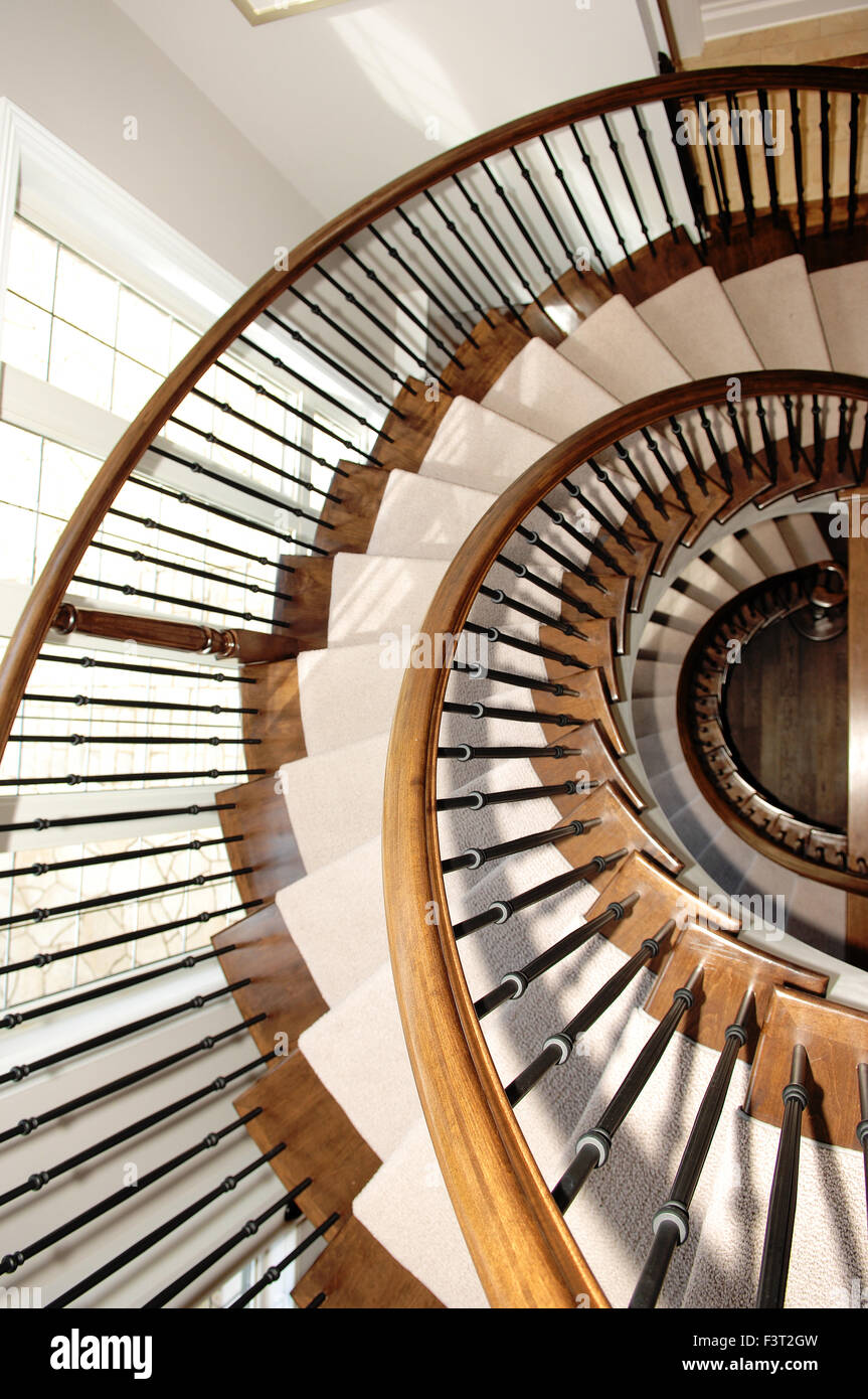 A beautiful round staircase in a closeup picture over three floors in ...