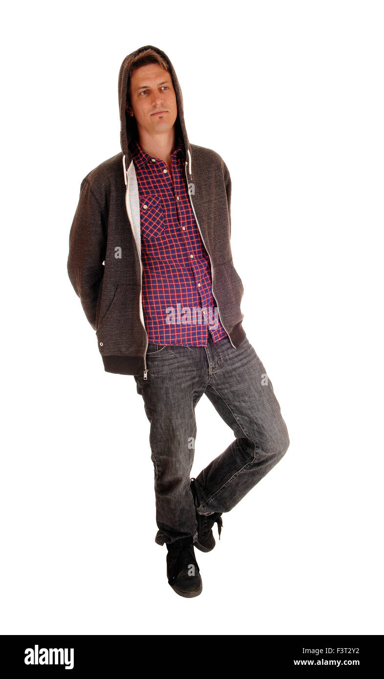 A full body picture of a handsome young man in a hoody and jeans ...