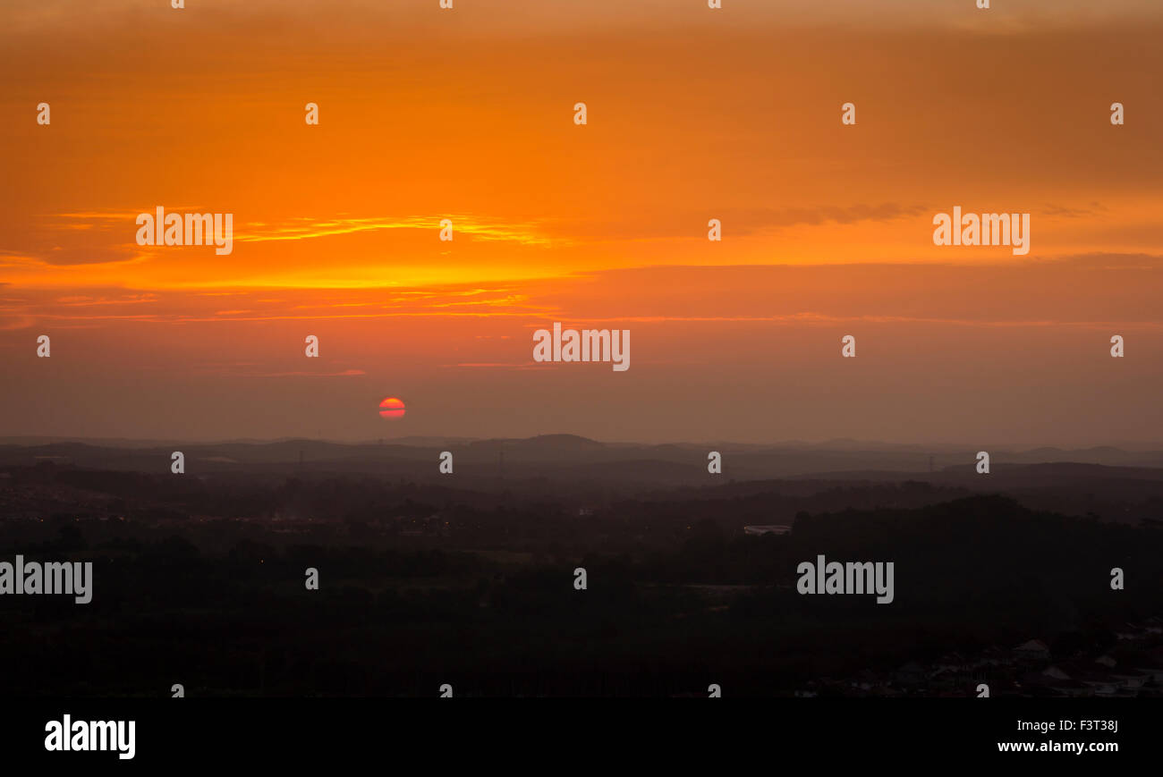 The setting sun on top of the hill scenery Stock Photo - Alamy