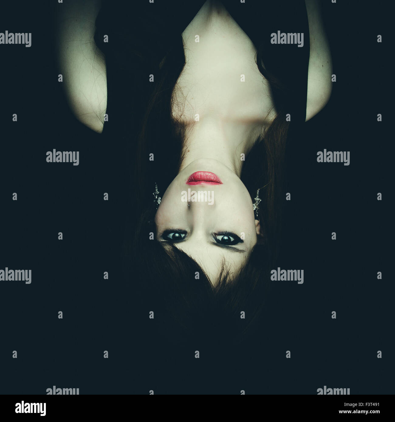 Horror Scene of a Woman Possessed, upside down Stock Photo - Alamy